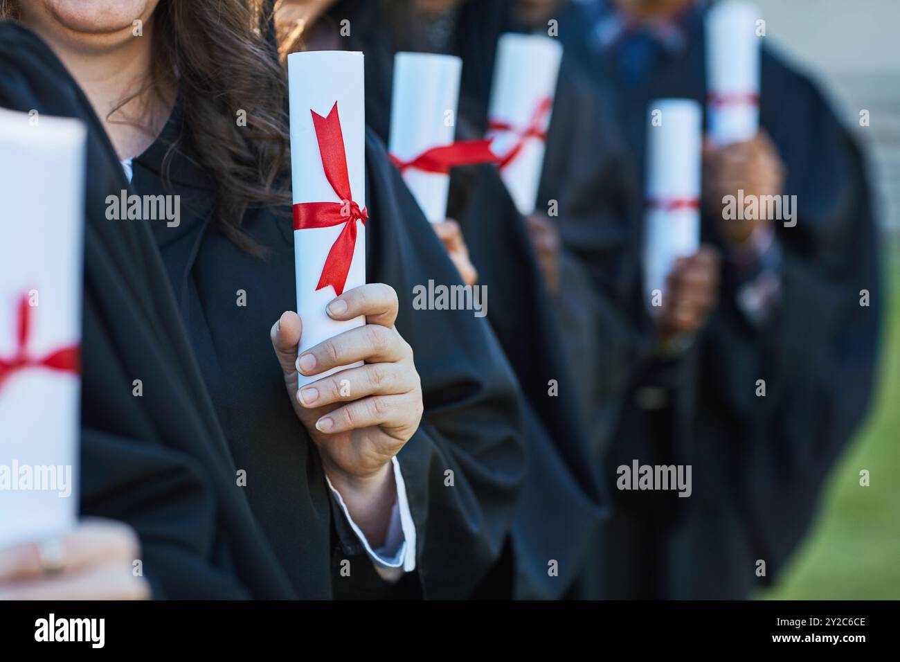 Students, graduation and certificate with hands, line and together with ...