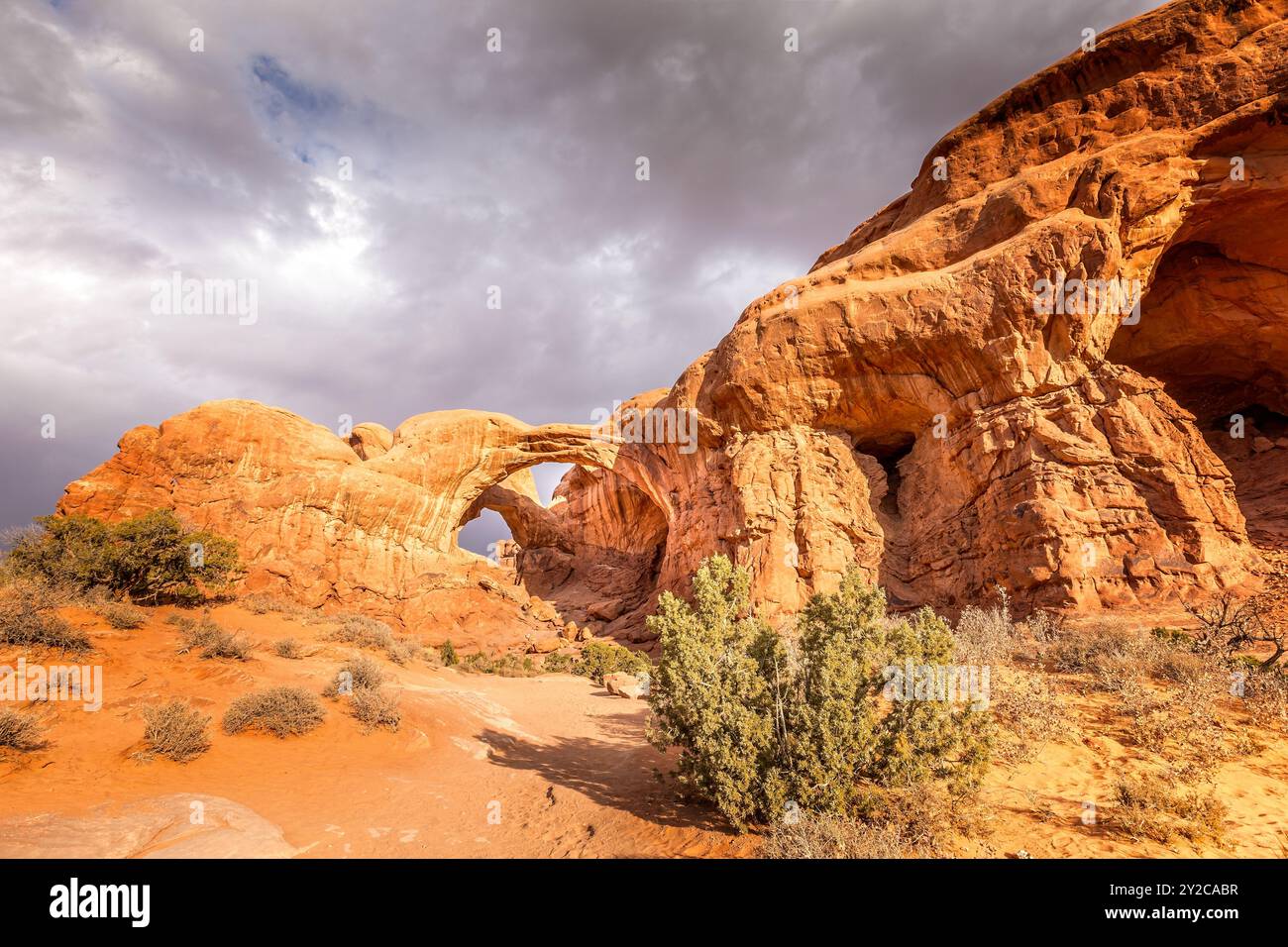 The Double Arch section in the Arches National Park on a stormy day ...