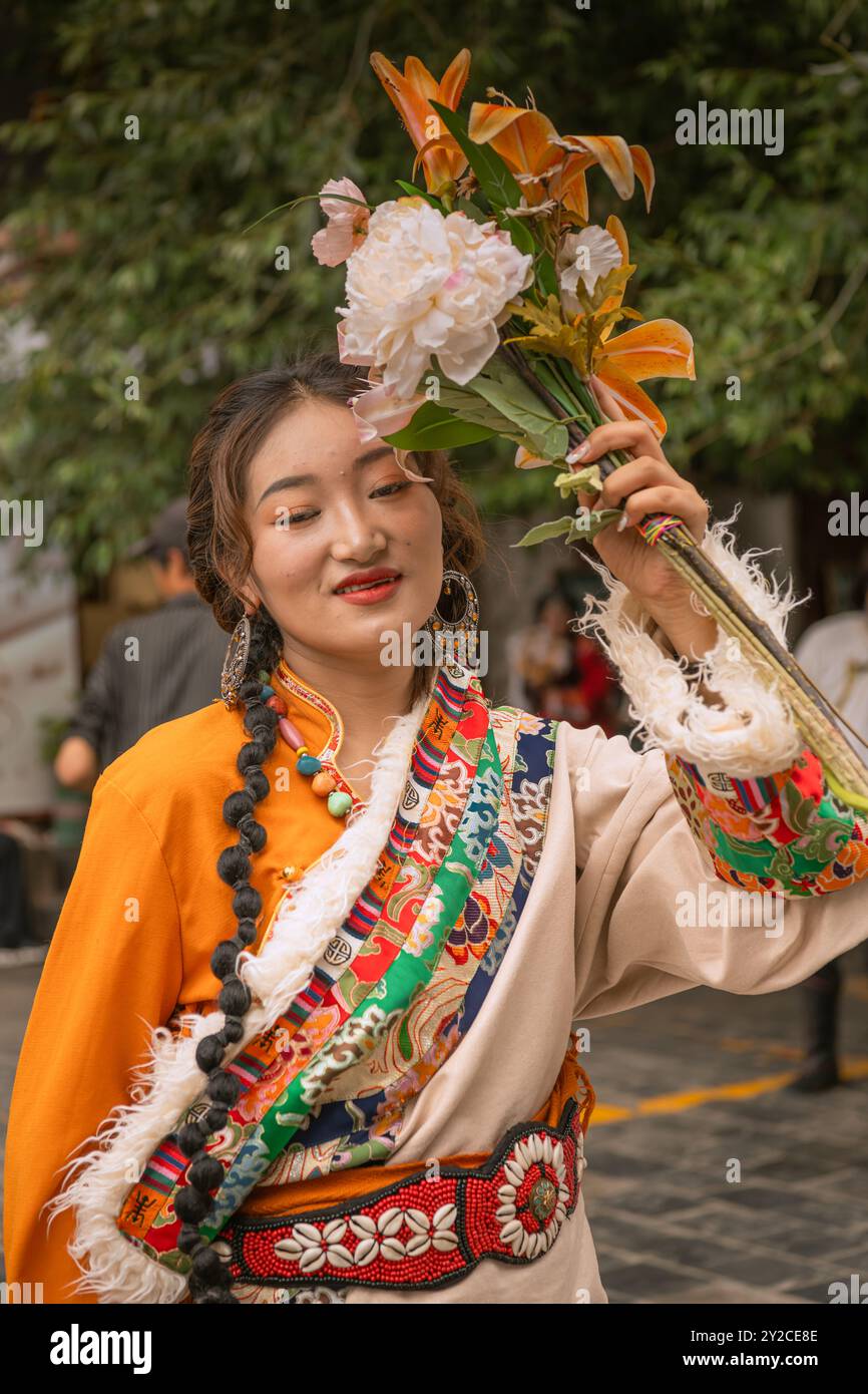 LHASA, TIBET CHINA - JULY 3, 2022: A girl wearing traditional Tibetan ...