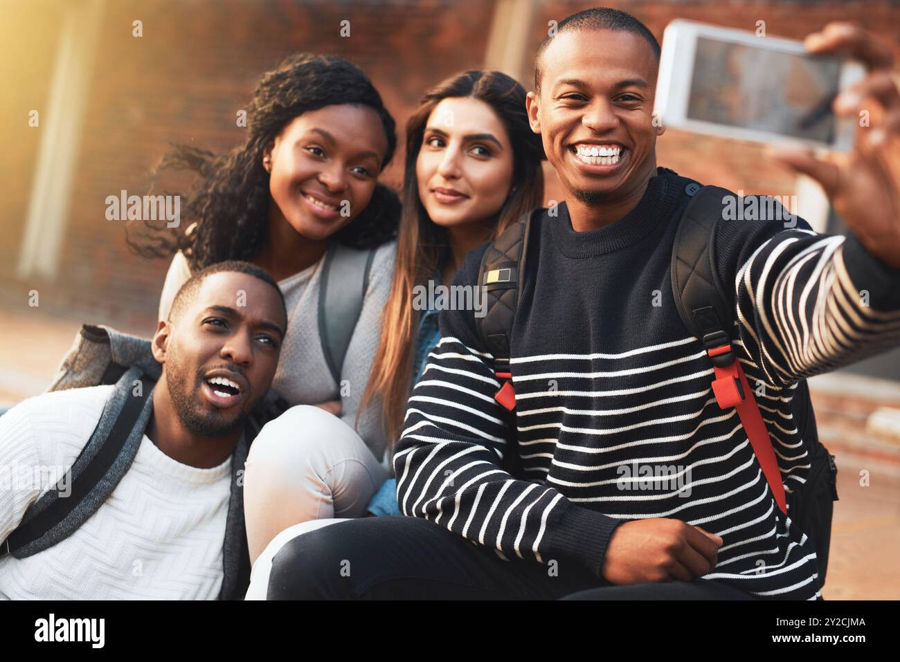 Happy friends, diversity and selfie of students at university together ...