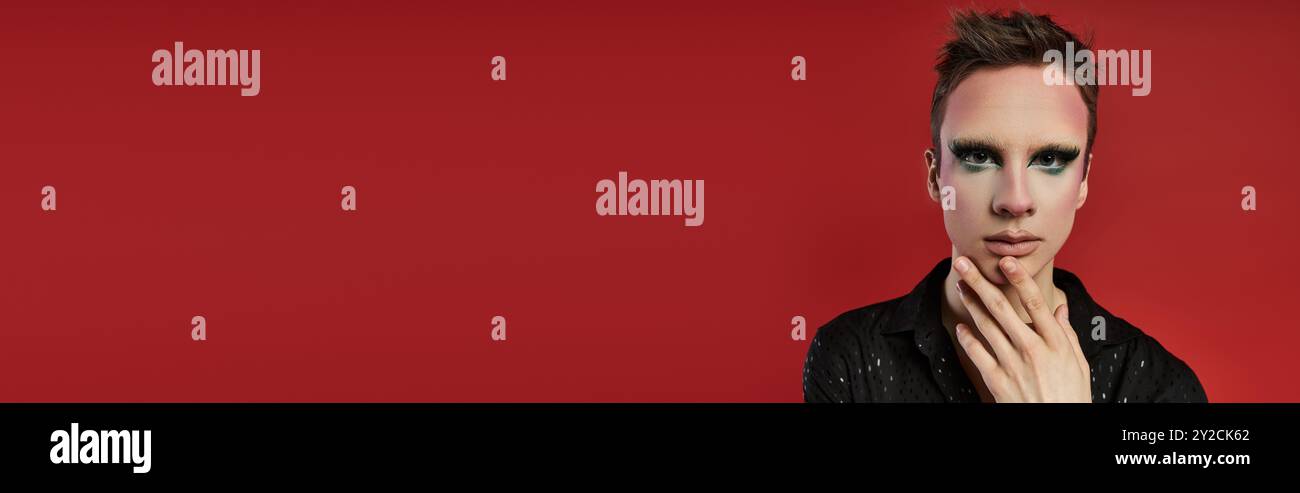 A dynamic young drag artist confidently poses in unique attire Stock ...