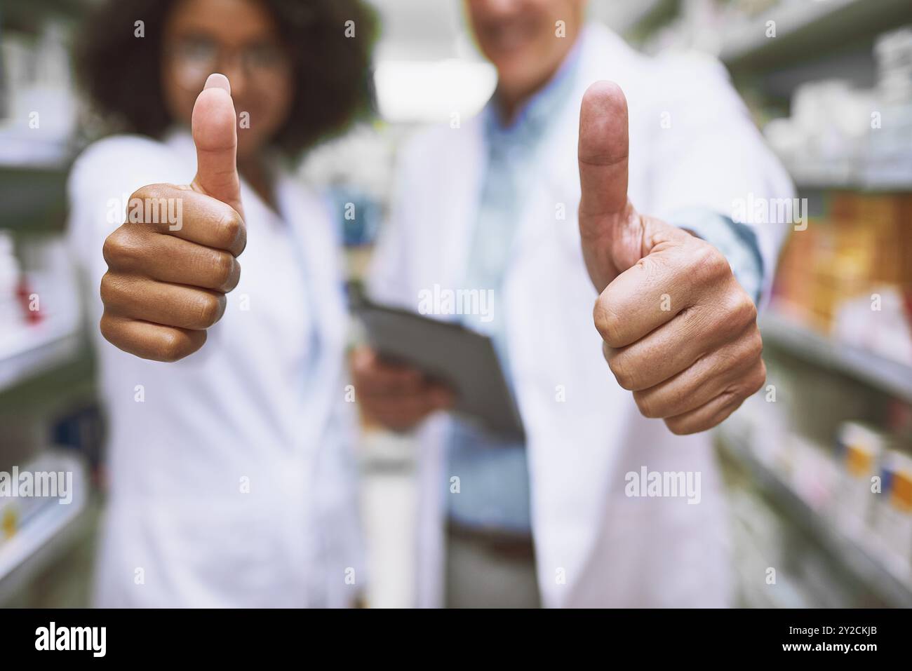Thumbs up, chemist and people in pharmacy, healthcare and proud of ...