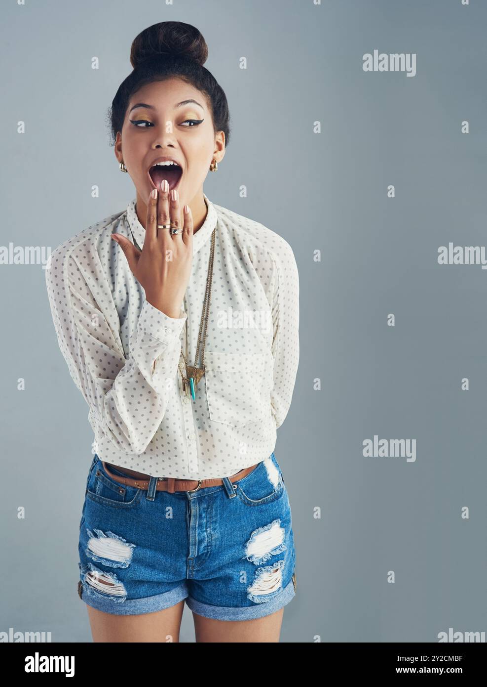 Woman, surprise and jewelry in studio for fashion, casual clothes and ...