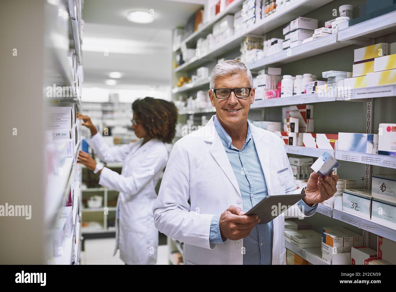 Portrait, tablet and mature man in pharmacy, smile and checklist for ...