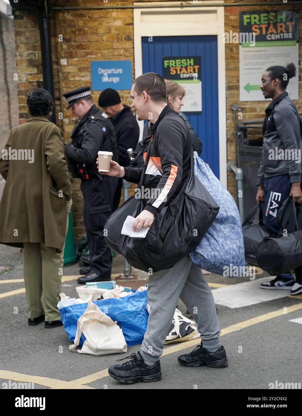 People seen outside HM Prison Brixton in London. Around 1,700 inmates ...