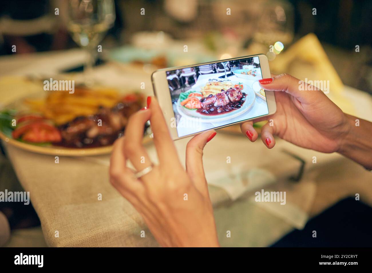 Hand, woman and smartphone screen for food photography on dinner in ...
