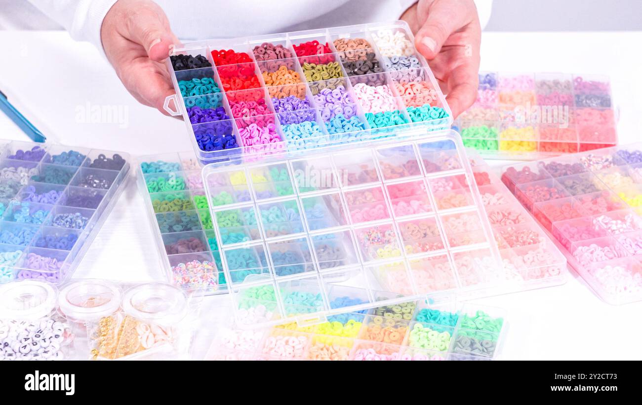 Woman's Hands Amidst a Rainbow Array of Beads for Jewelry Crafting ...