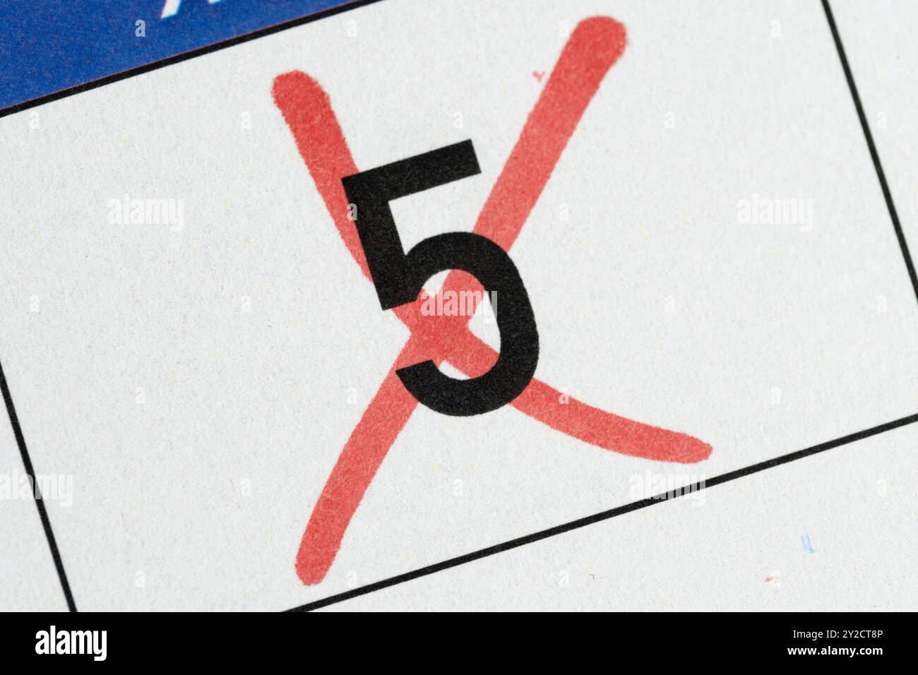 Fifth number is crossed out with red marker on calendar Stock Photo - Alamy