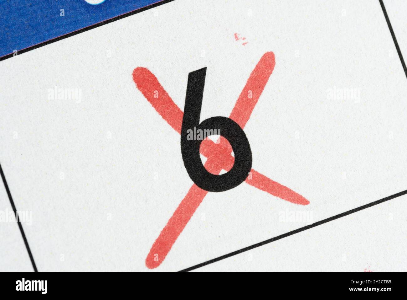 Sixth number is crossed out with red marker on calendar Stock Photo - Alamy