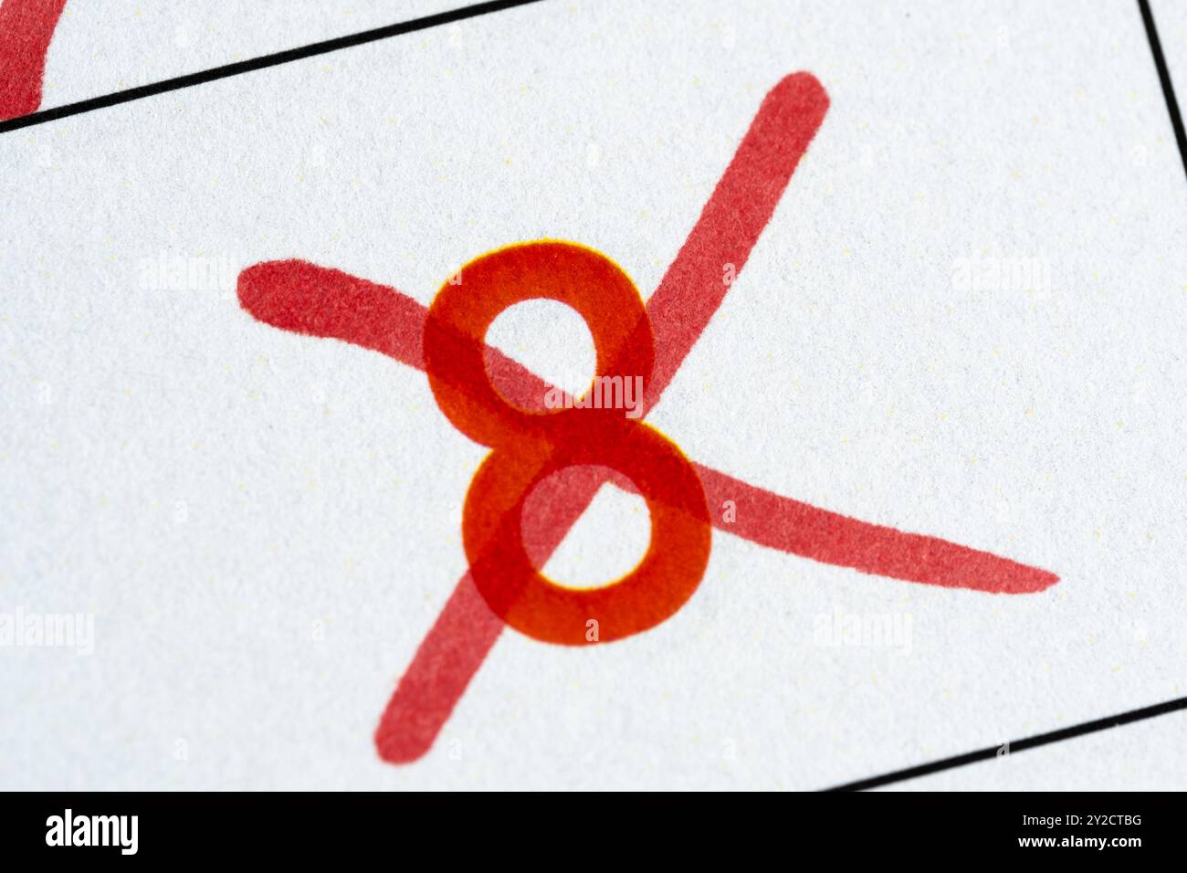 Eighth number is crossed out with red marker on calendar Stock Photo ...