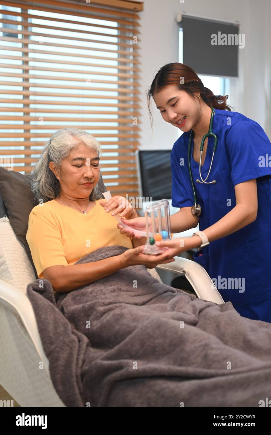Physical therapist using Incentive Spirometer or Triflow to help ...