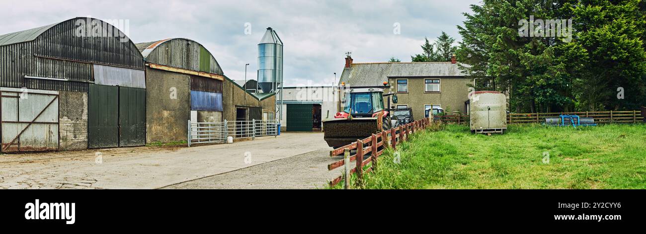 Outdoor, building and tractor on farm for agriculture, landscape and ...