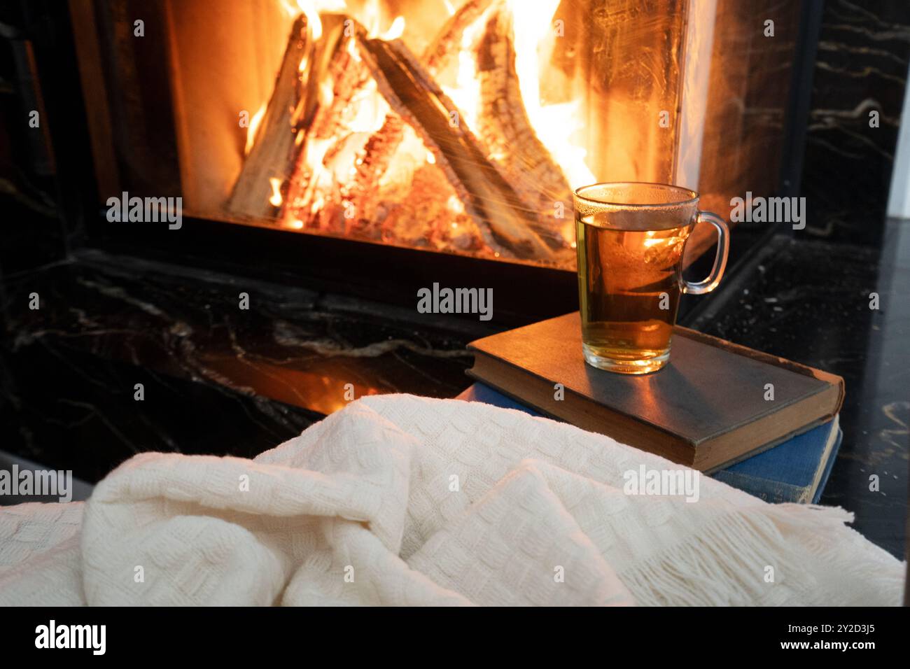 A warm and inviting cozy reading corner by the fireplace is perfect ...