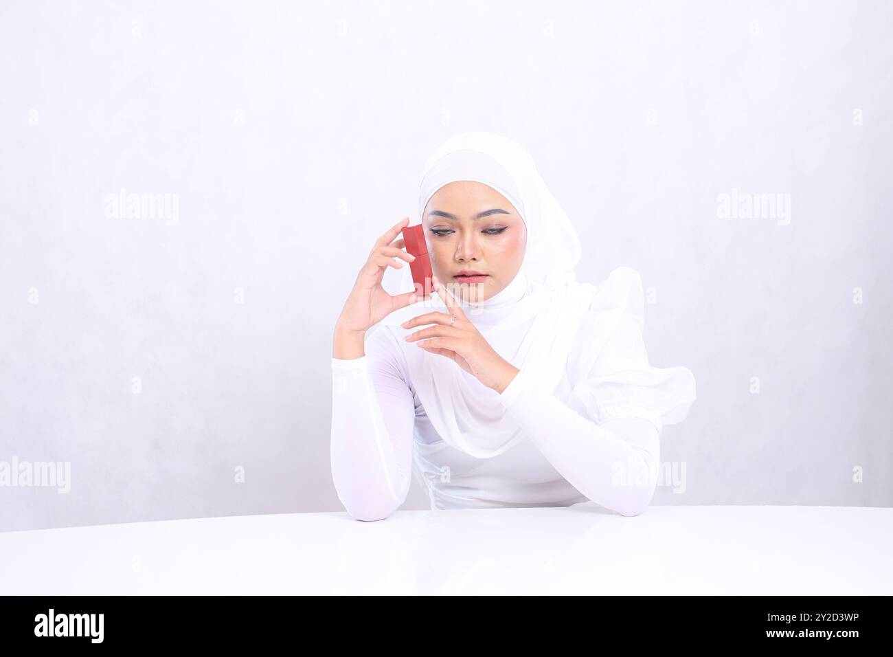 closeup makeup lips Beautiful young hijab woman closed eyes hands ...