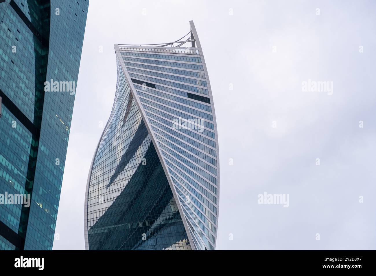 Modern Moscow City towers against a blue sky. Tall glass skyscrapers ...