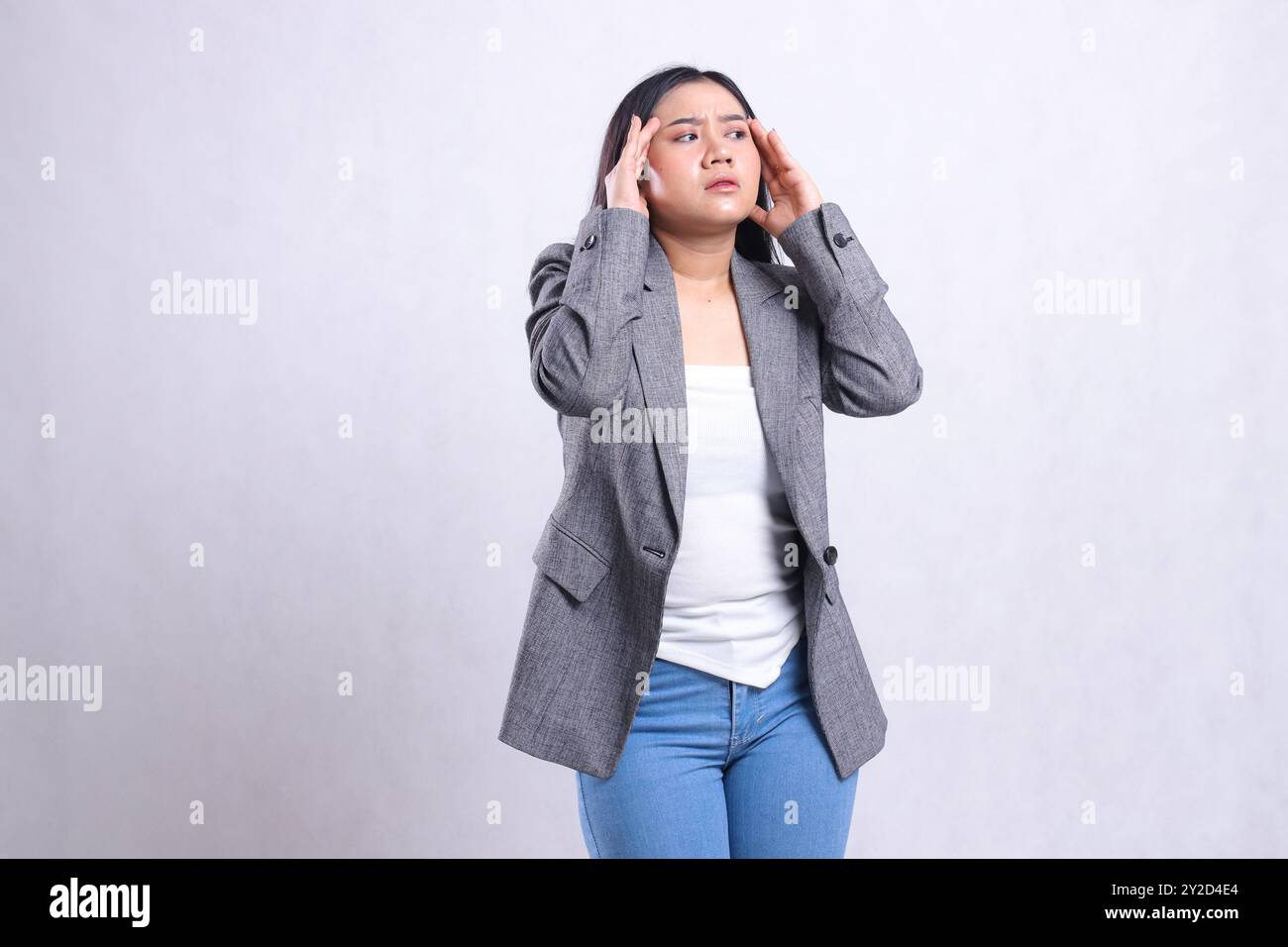 expression of beautiful young office girl asia dizzy both hands hold ...