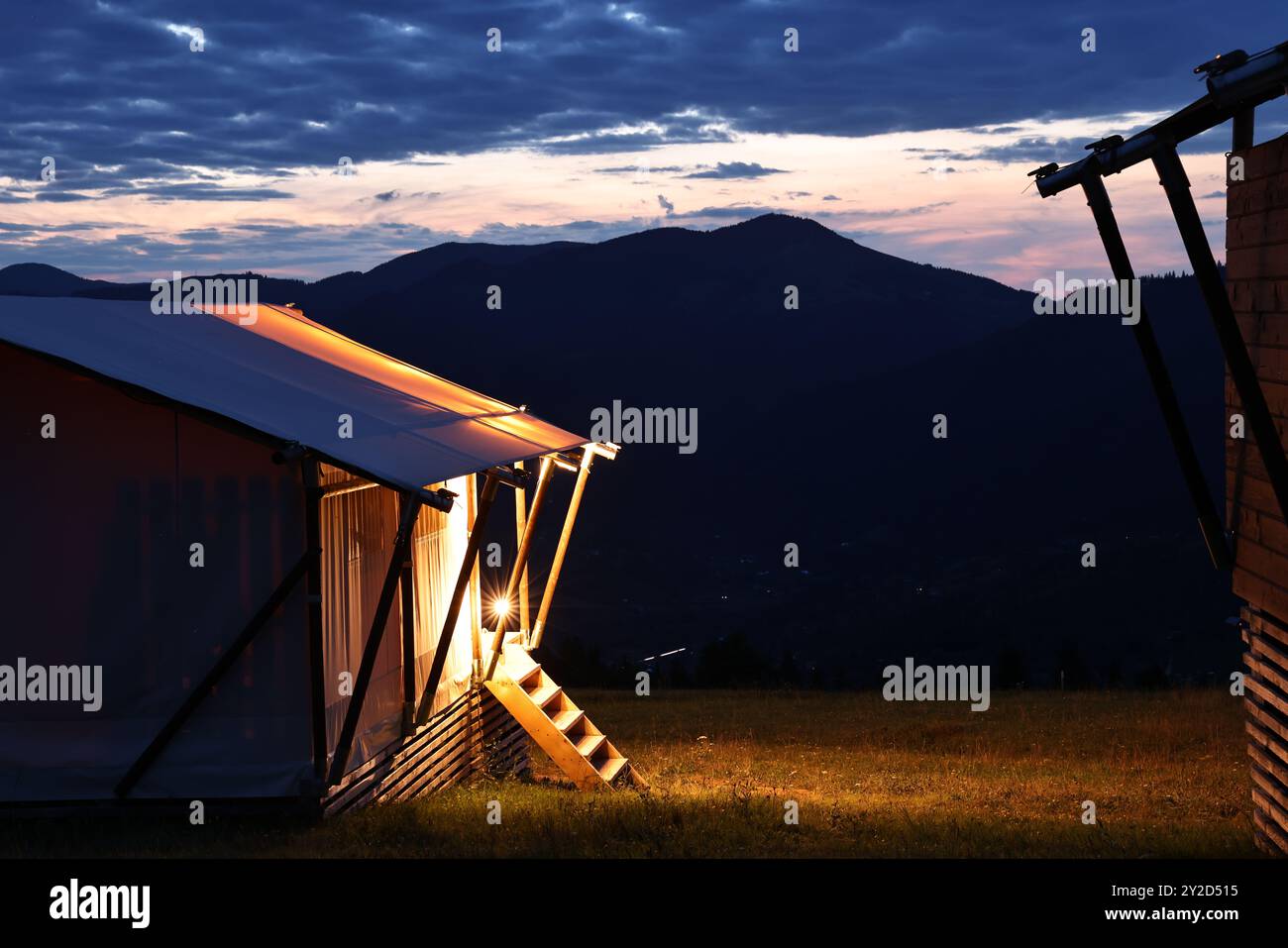 Tent in mountains at night. Glamping site Stock Photo - Alamy