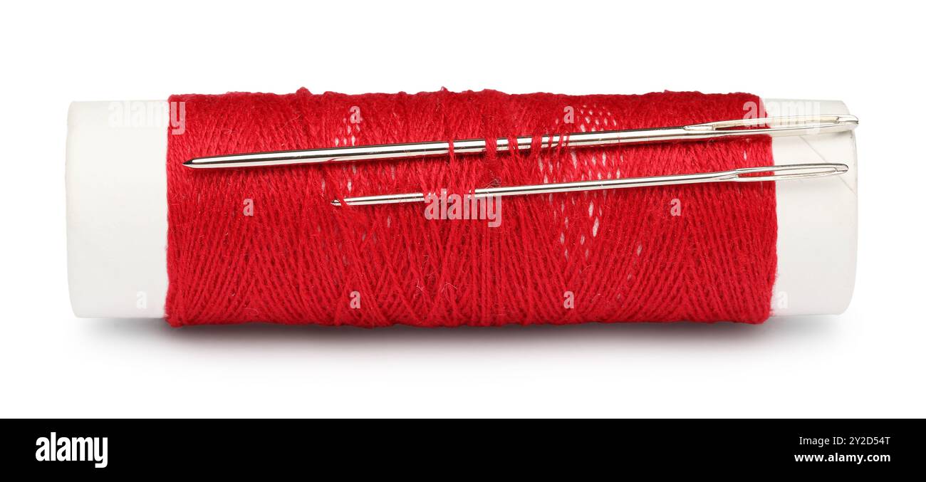Spool of red sewing thread with needles isolated on white Stock Photo ...
