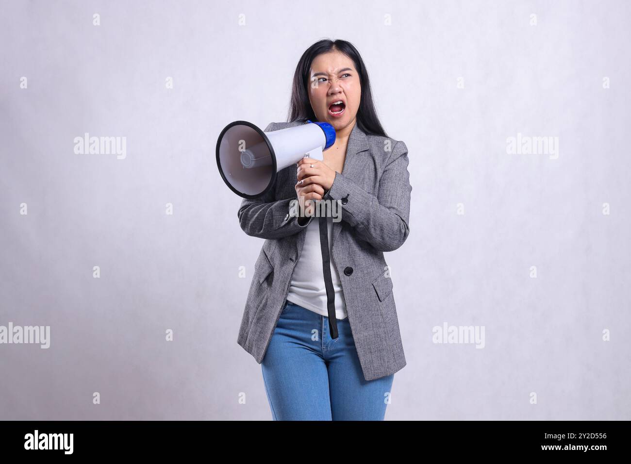 beautiful female formal angry candid screaming both hands holding ...