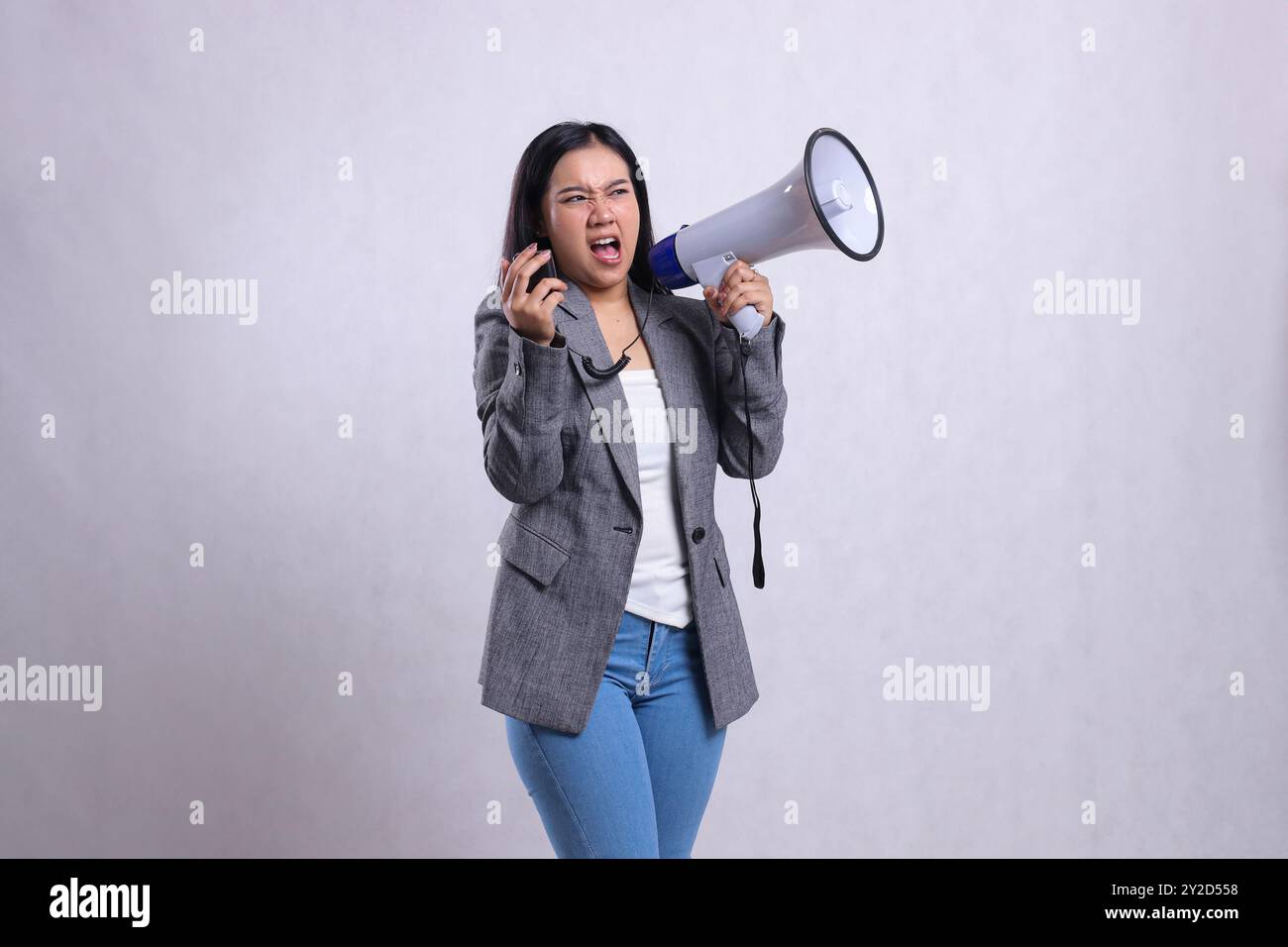 formal beautiful young lady shouting to the left shouting candid hand ...