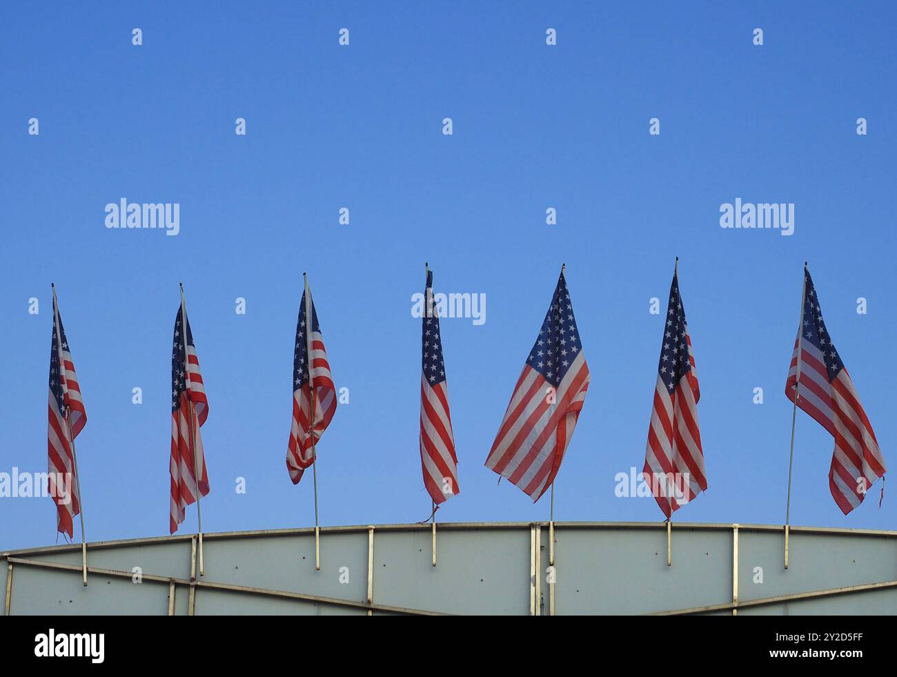 many american flags of the united states of america over blue sky Stock ...