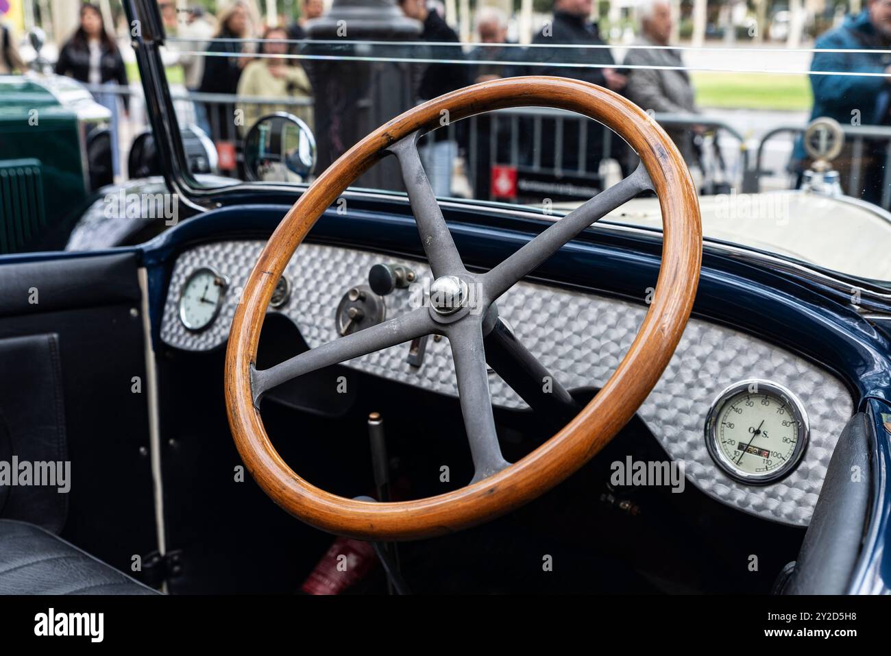 Wooden steering wheel and dashboard of an old retro car from the 1920s ...