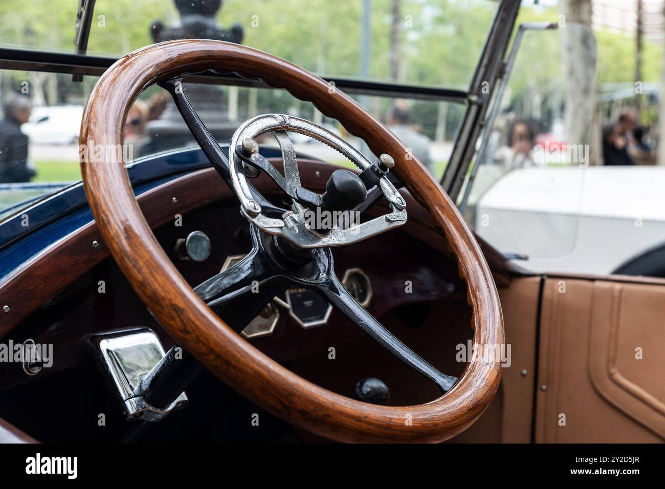 Wooden steering wheel and dashboard of an old retro car from the 1920s ...