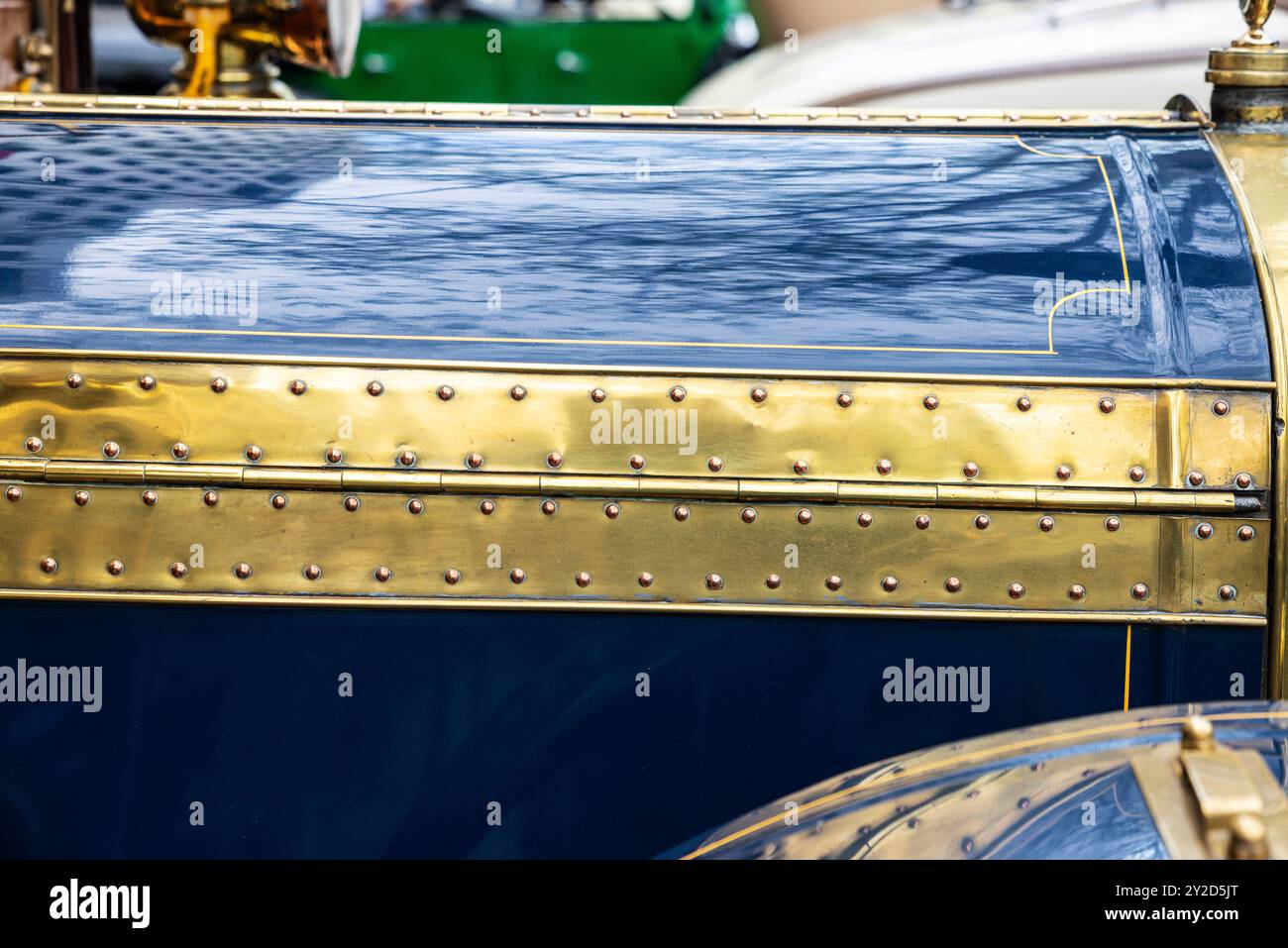 Blue and colden sheet metal hood of an old retro car from the 1920s ...