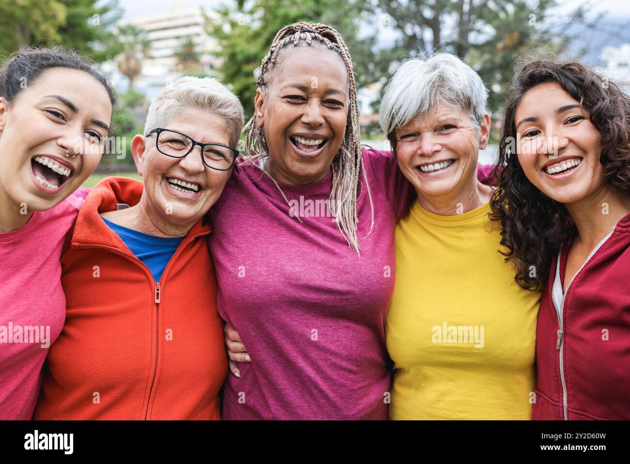 Happy multi generational women having fun together - Multiracial friends laughing on camera ...