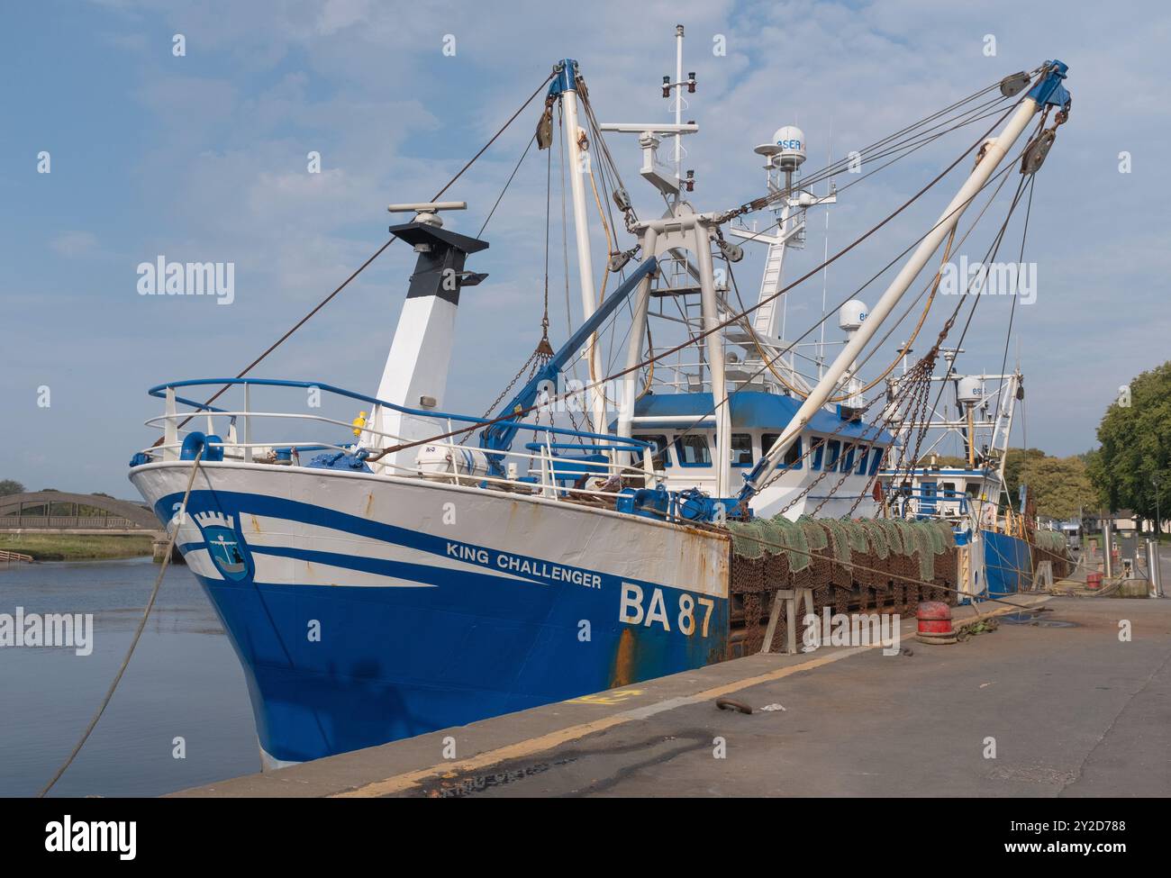 A scallop dredger fishing boat berthed at Kirkcudbright harbour with ...