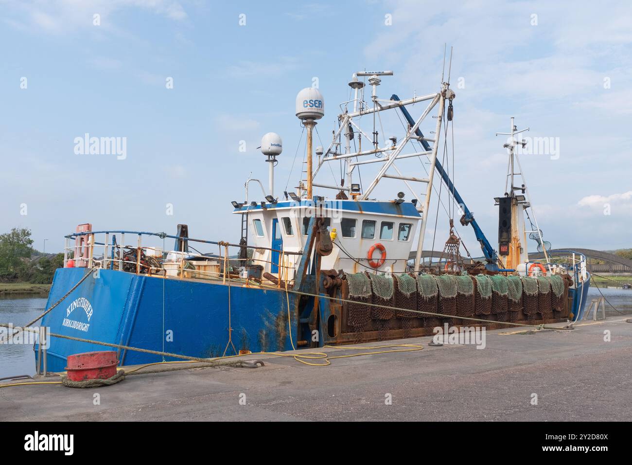 A scallop dredger fishing boat berthed at Kirkcudbright harbour with ...