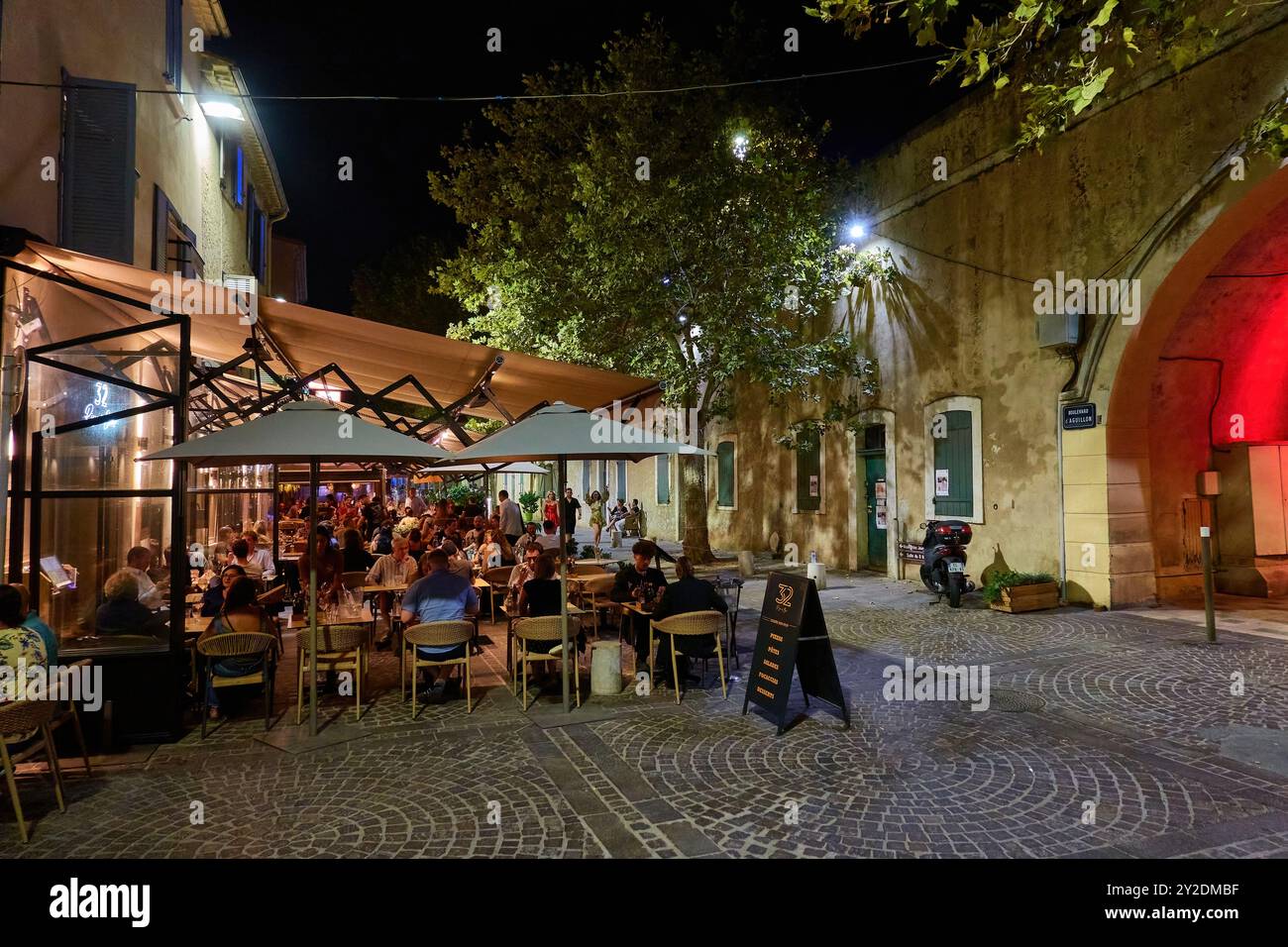 Cafes and bars at night in the Old town of Antibes on the French ...