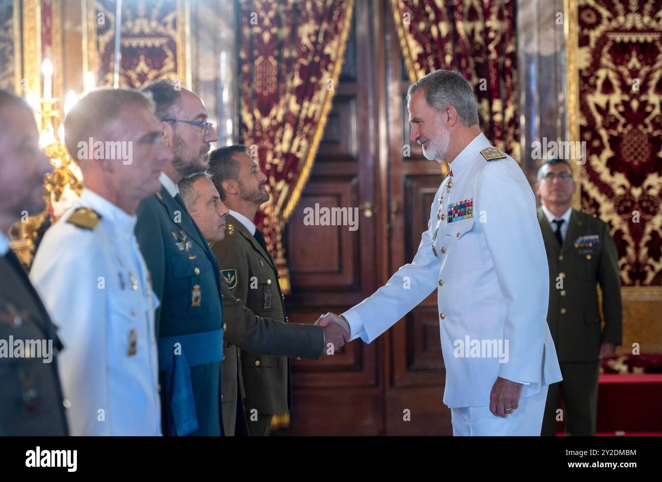 King Felipe VI (r) greets a group of colonels and naval captains during ...