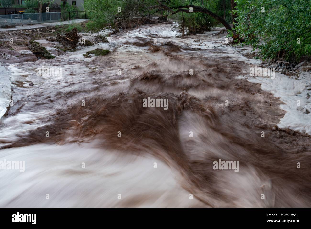 Slow shutter speed smoothing out the turbulent waters of flash flooding ...