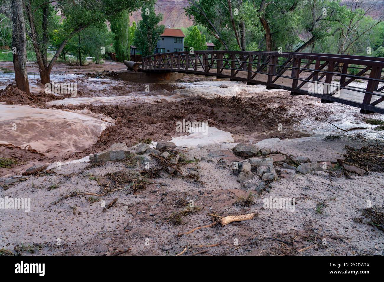 Flash flooding overflowing the banks of Mill Creek after a summer rain ...