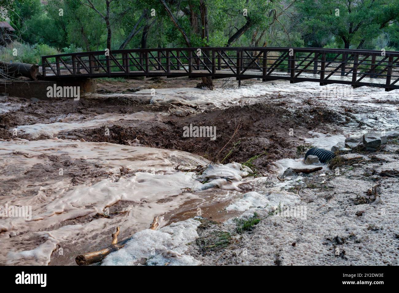 Flash flooding overflowing the banks of Mill Creek after a summer rain ...
