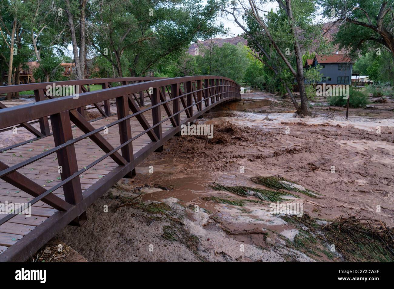 Flash flooding overflowing the banks of Mill Creek after a summer rain ...