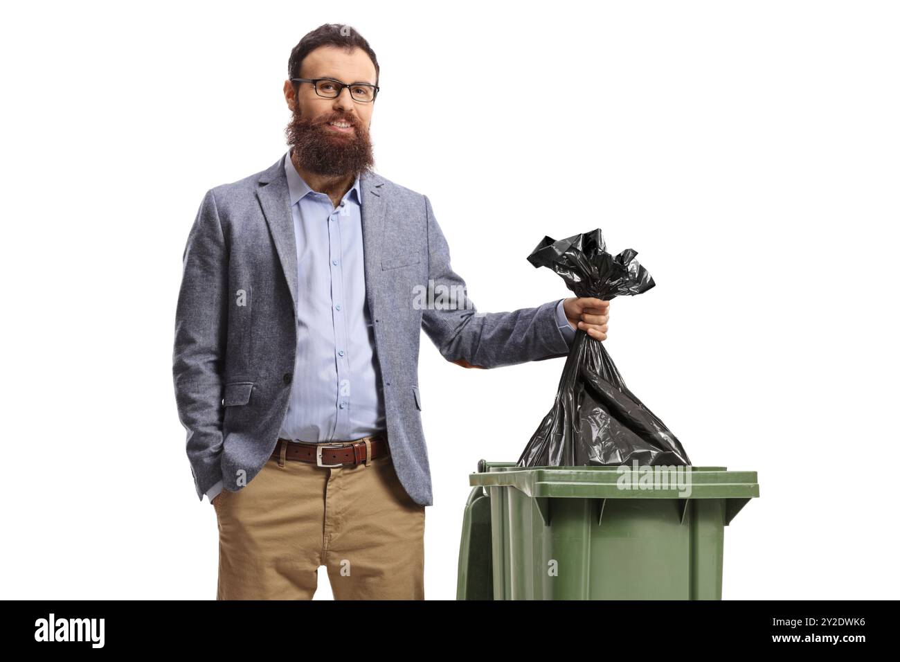 Bearded man throwing a bin bag in a dustbin isolated on white ...