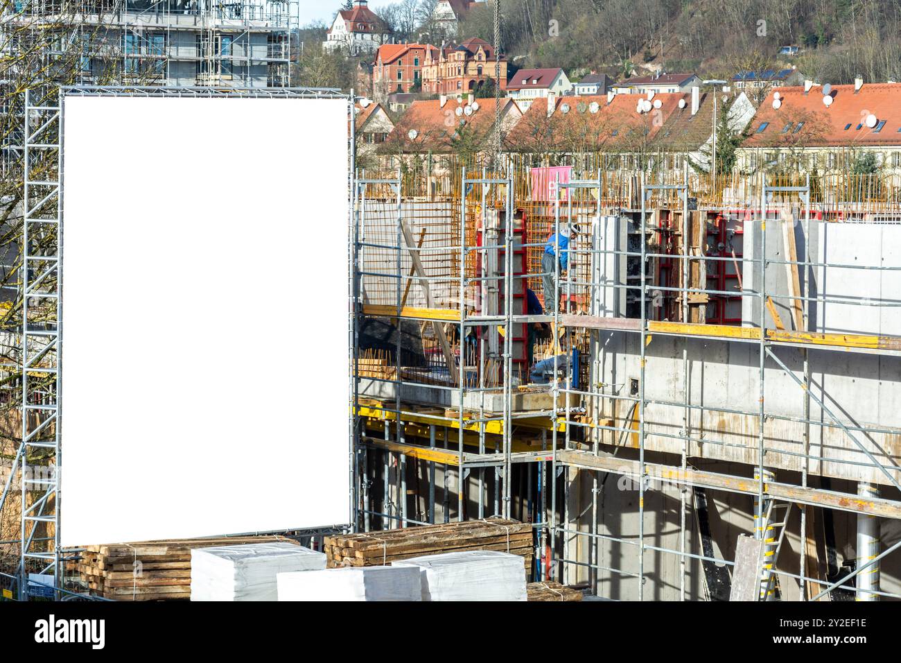 Construction site with scaffolding and large blank poster Stock Photo ...