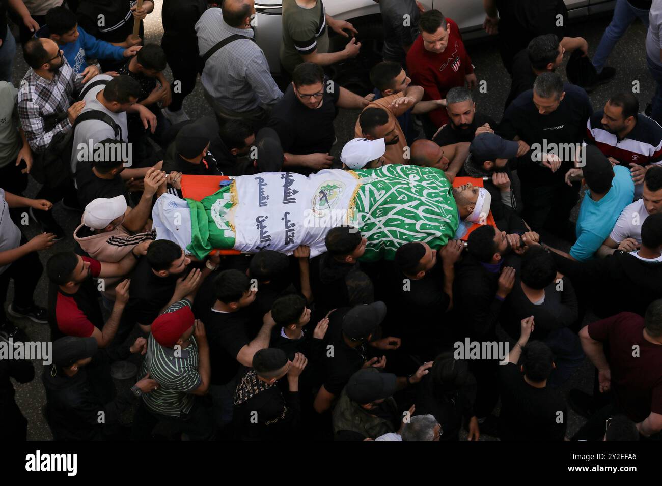 West Bank, Palestine. 04 May 2023. Mourners carry the body of three ...