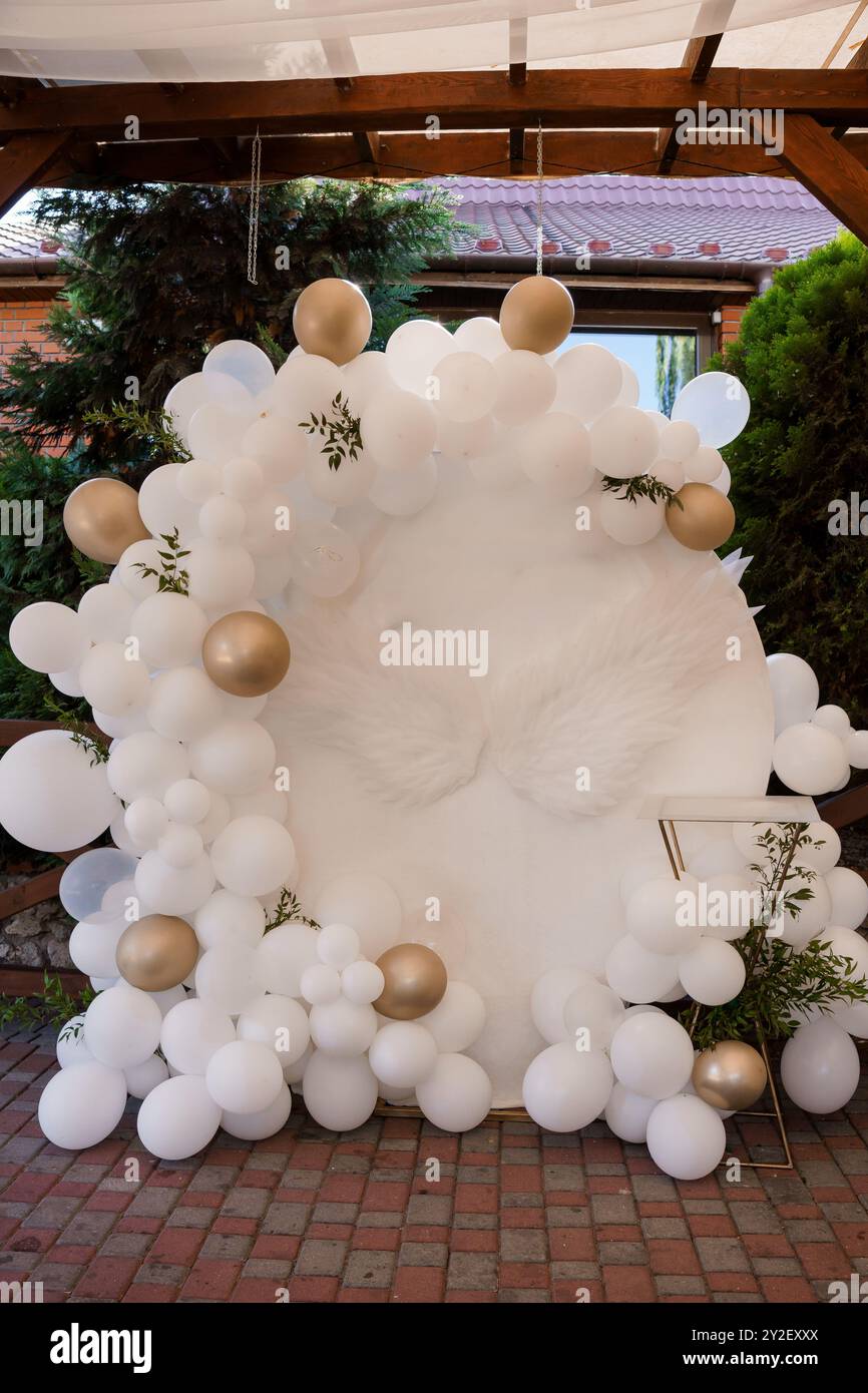 Elegant White and Gold Balloon Arch with Angel Wing Backdrop Display ...