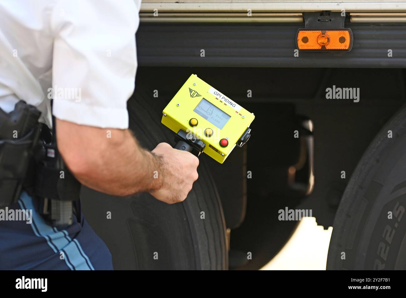 Police officer with hand detector. Methodology for determining whether ...