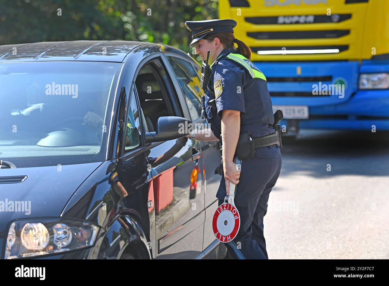 Police officers, policewoman checks vehicles. The Bavarian border ...