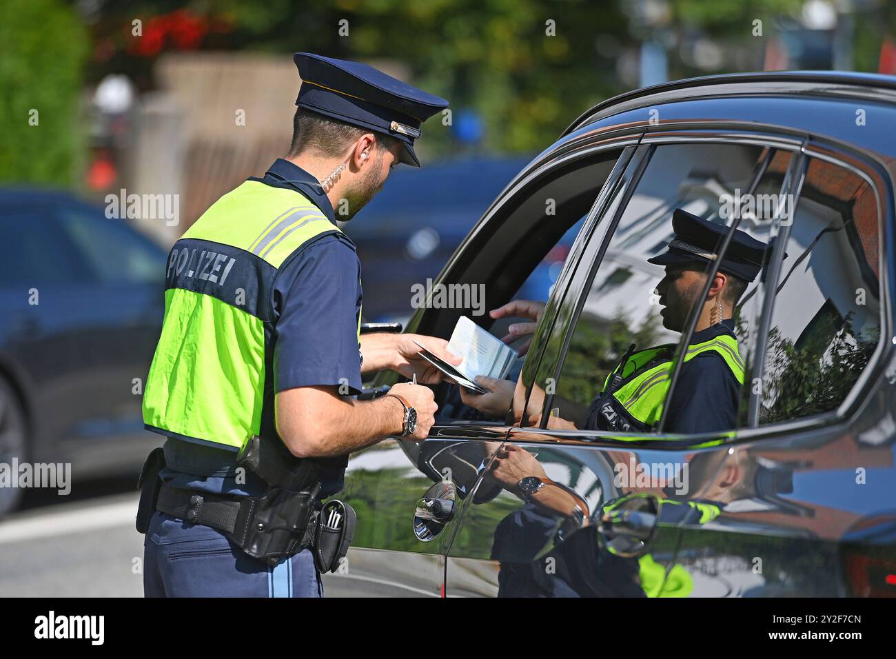 Police officers check vehicles and vehicle documents. The Bavarian ...