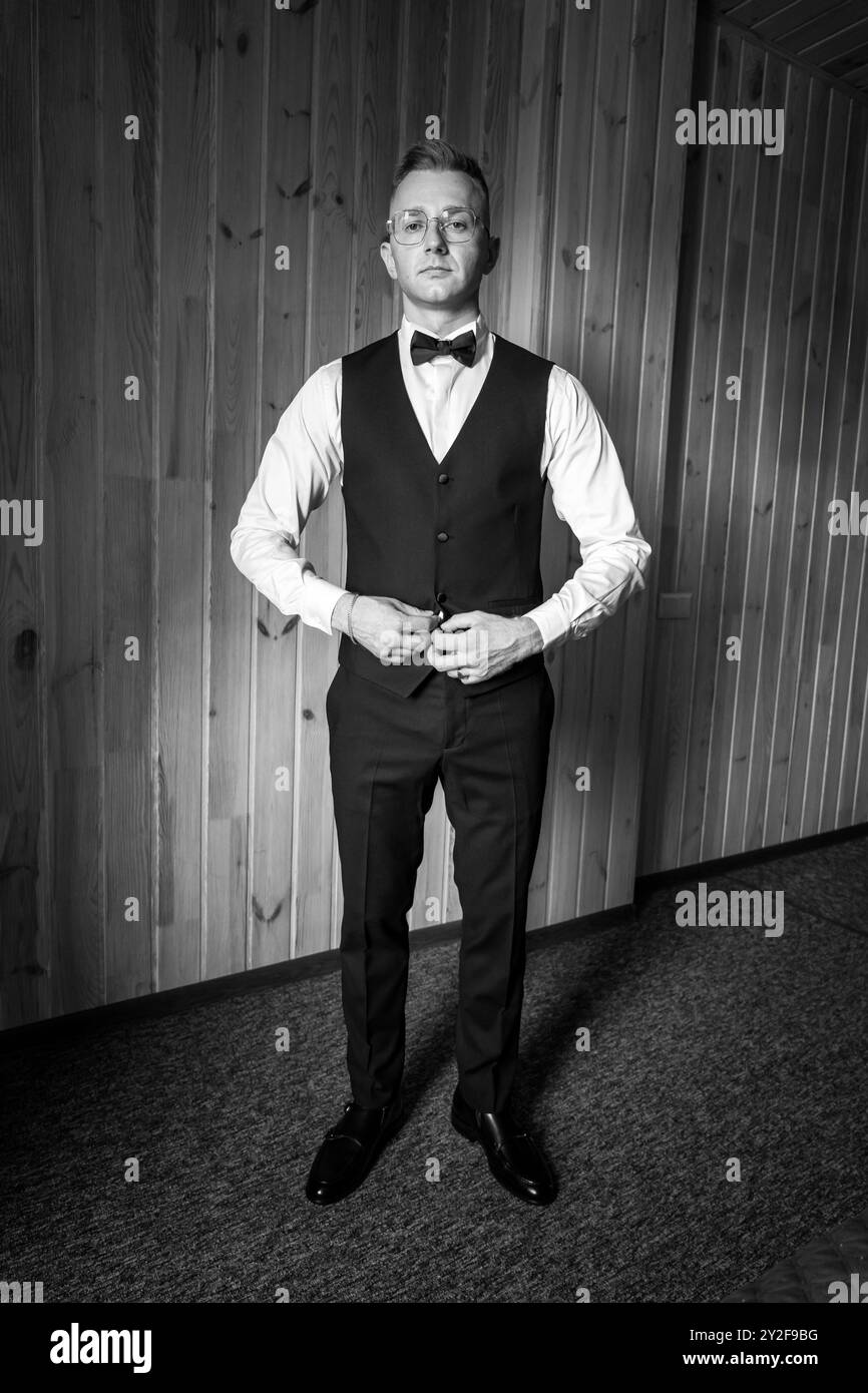 Elegant Gentleman in Formal Attire Posing in Wood-Panelled Room - Black ...