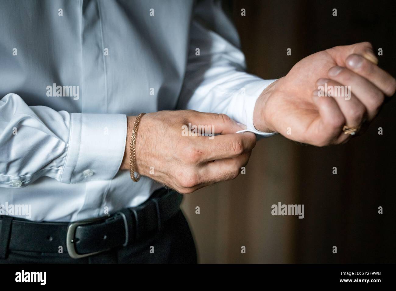 Elegant Close-Up of a Man Adjusting Shirt Cuff for Formal Attire ...