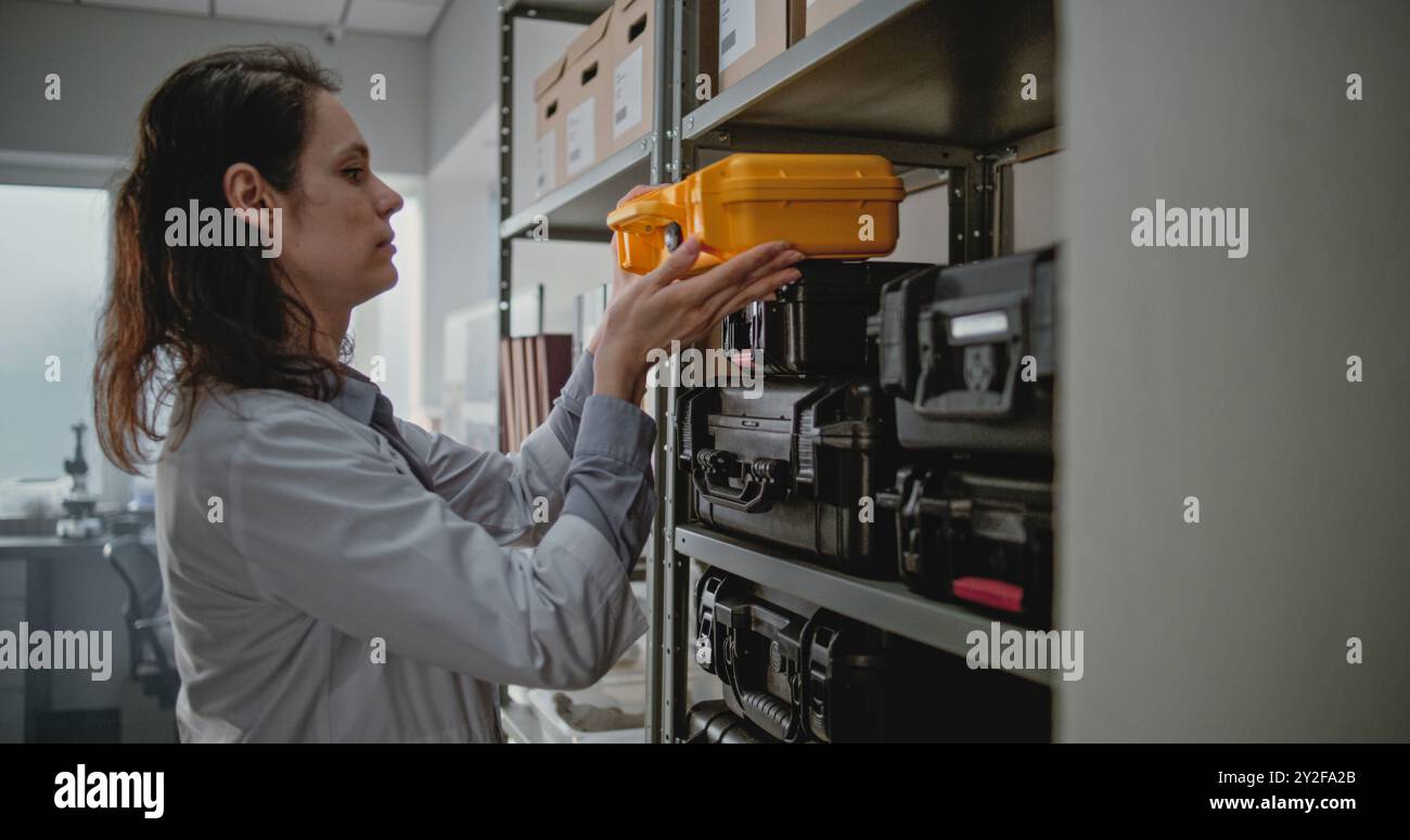 Female paleontologist studying fossils hi-res stock photography and ...