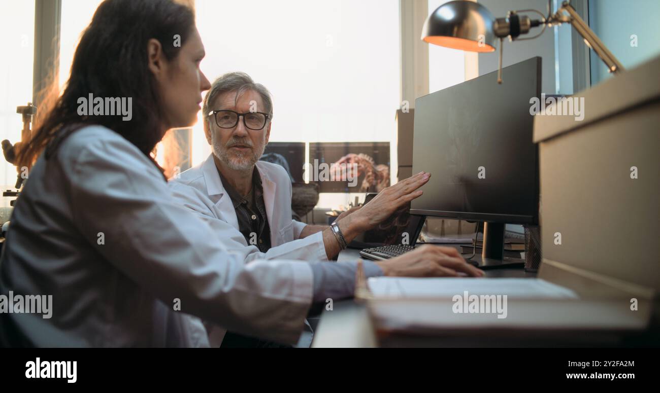 Two diverse scientists discuss 3D visualization of ancient human head ...