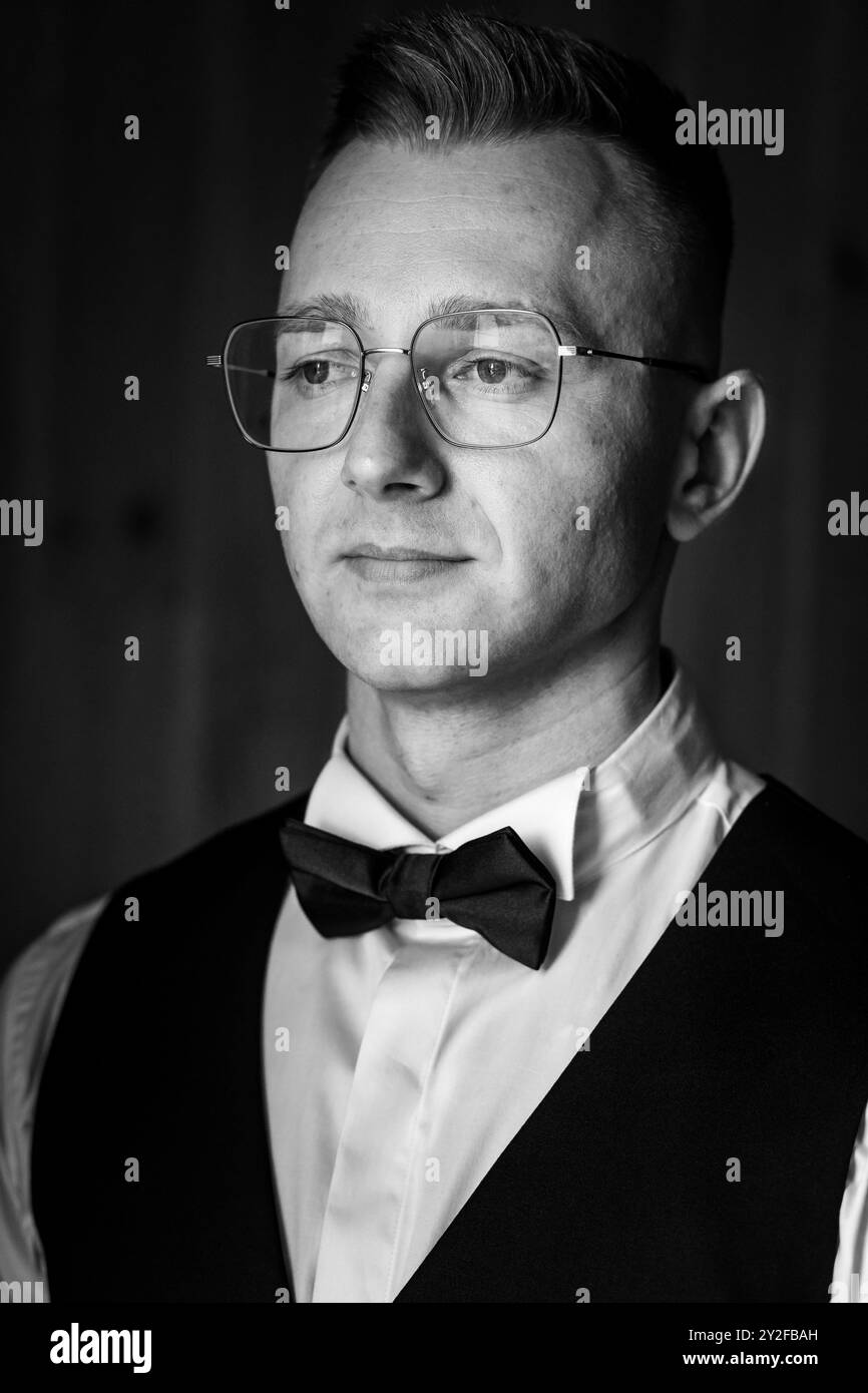 Elegant Monochrome Portrait of a Young Man in Formal Attire with ...