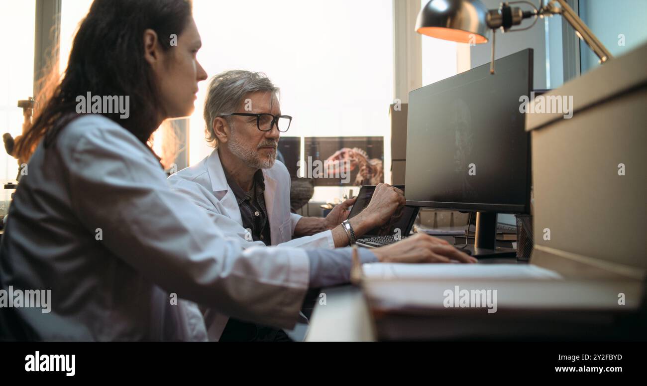 Two diverse scientists discuss 3D visualization of ancient human head ...